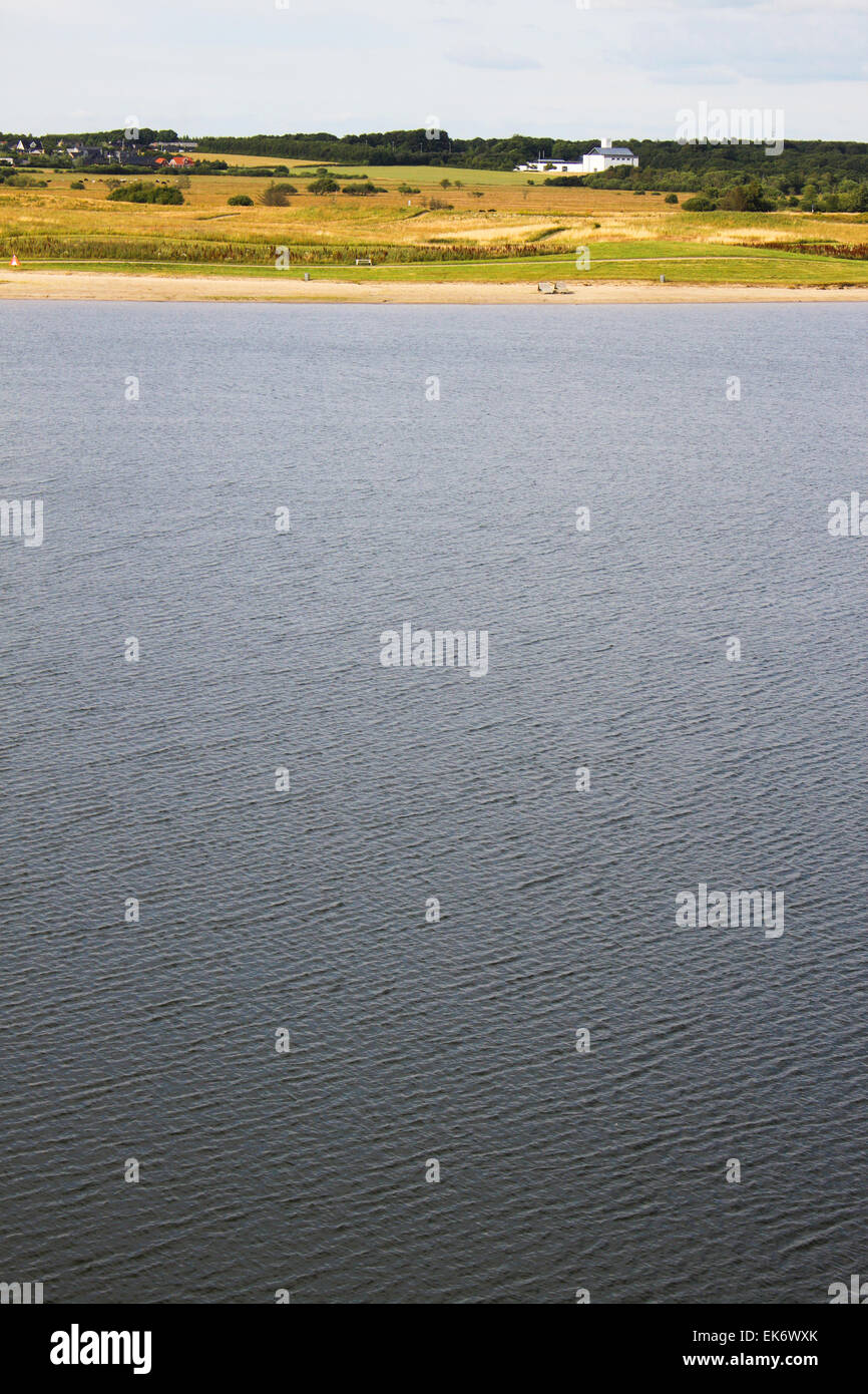 Lake side of rural part of Denmark with a wave structure on the surface ...