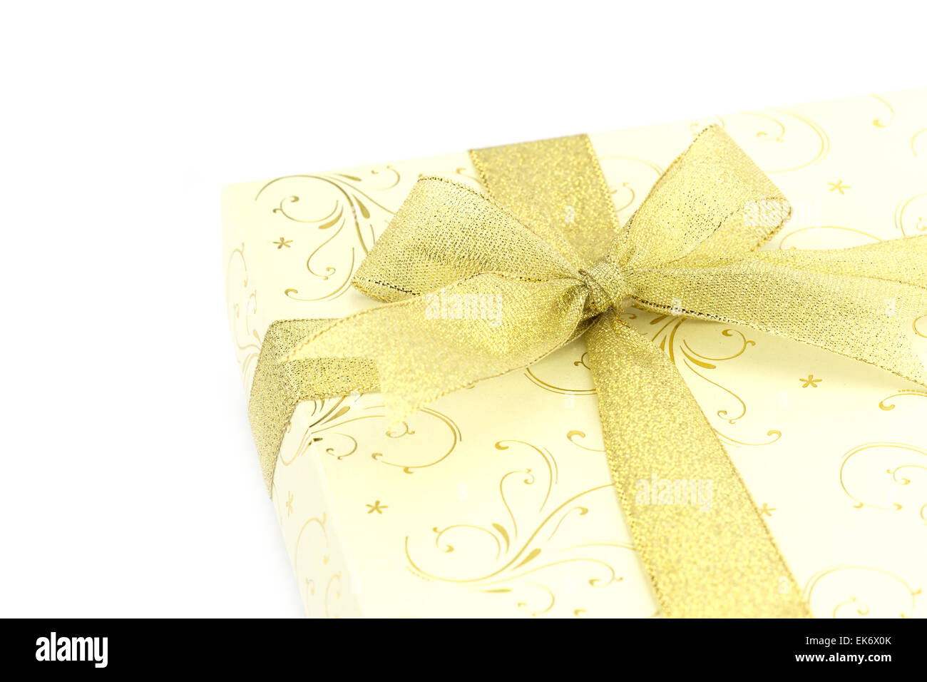 gift box with gold ribbon bow isolated on white background Stock Photo ...