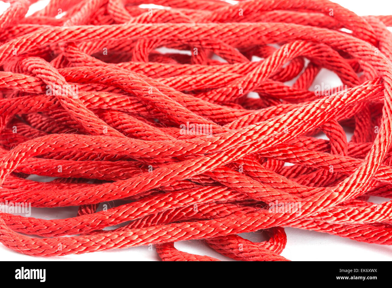 Red rope isolated on white background Stock Photo - Alamy