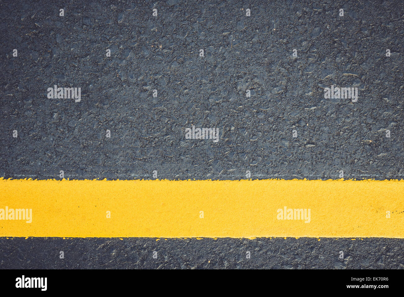 Asphalt road texture with yellow stripe Stock Photo - Alamy