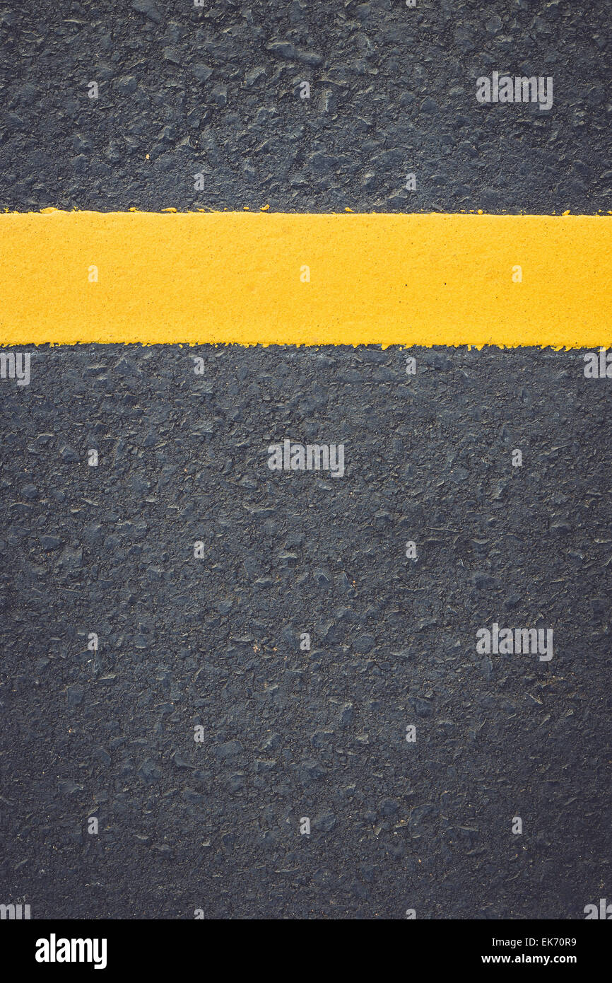 Asphalt road texture with yellow stripe Stock Photo - Alamy