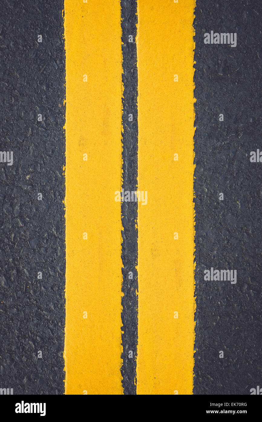Asphalt road texture with yellow stripe Stock Photo - Alamy