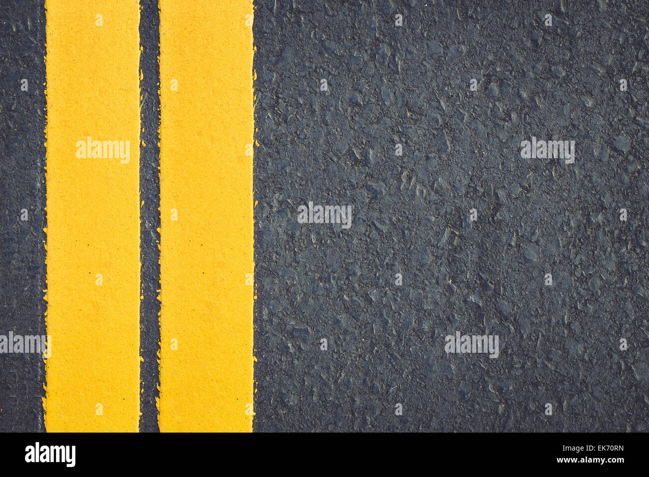 Asphalt road texture with yellow stripe Stock Photo - Alamy