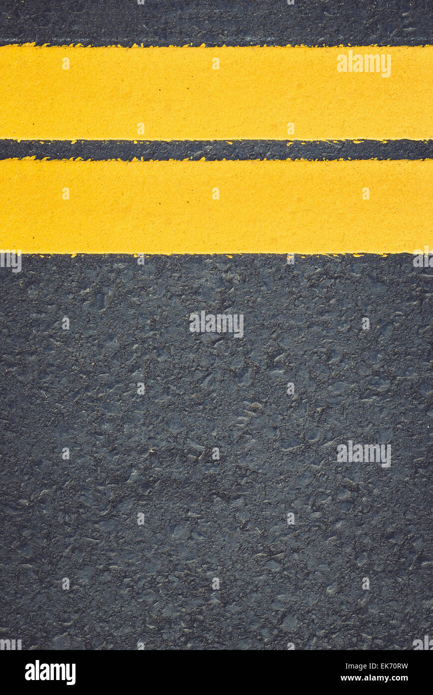 Asphalt road texture with yellow stripe Stock Photo - Alamy