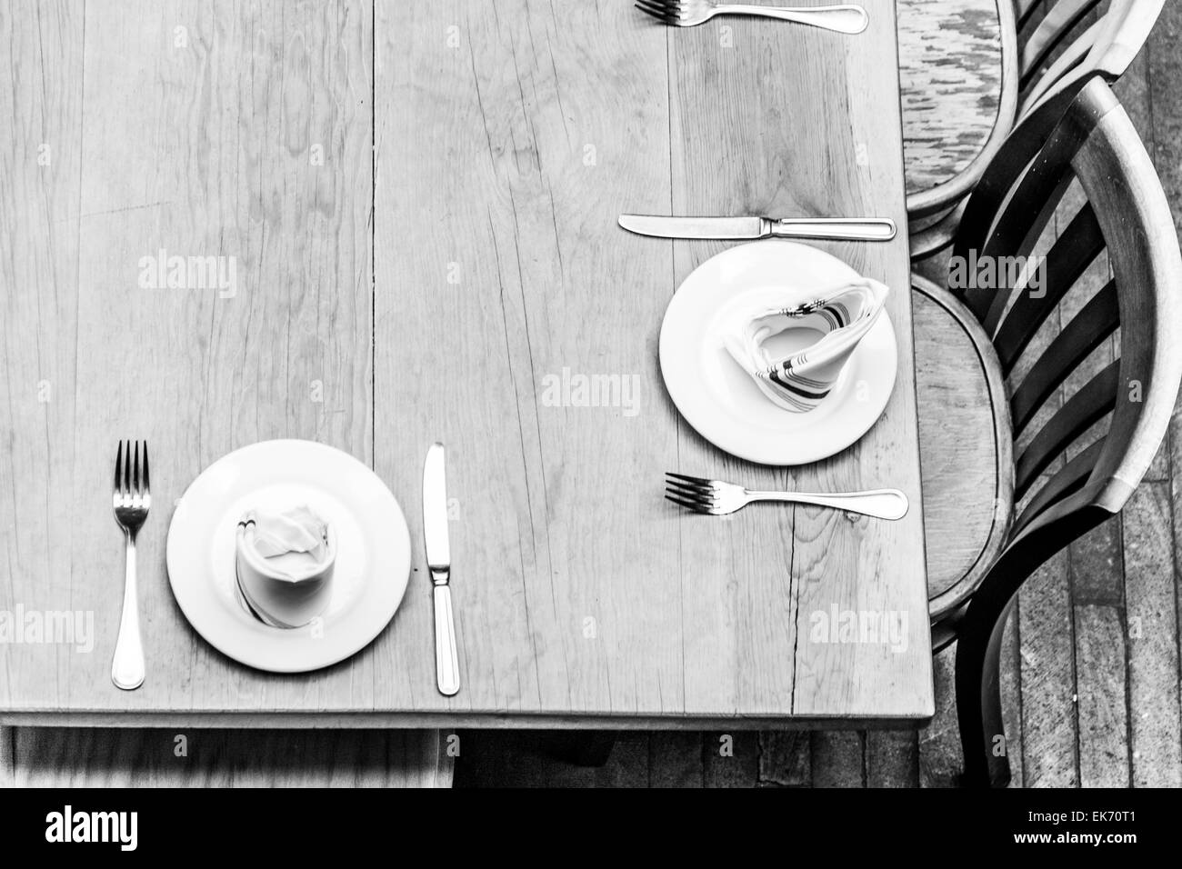 A table in a restaurant shot from above with two plates Stock Photo - Alamy