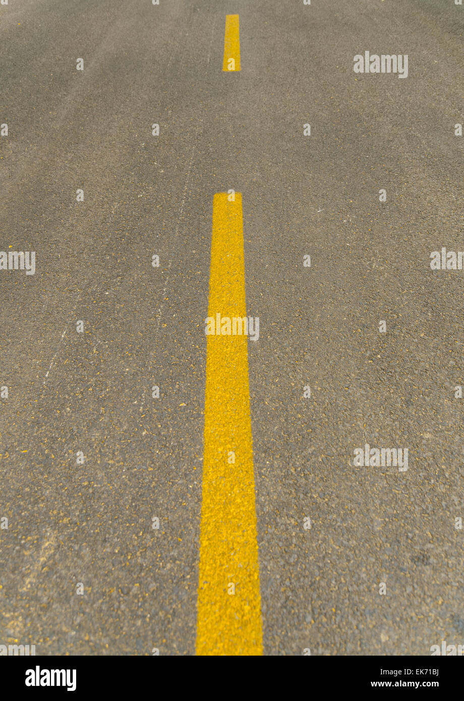 asphalt road and straight yellow line Stock Photo - Alamy