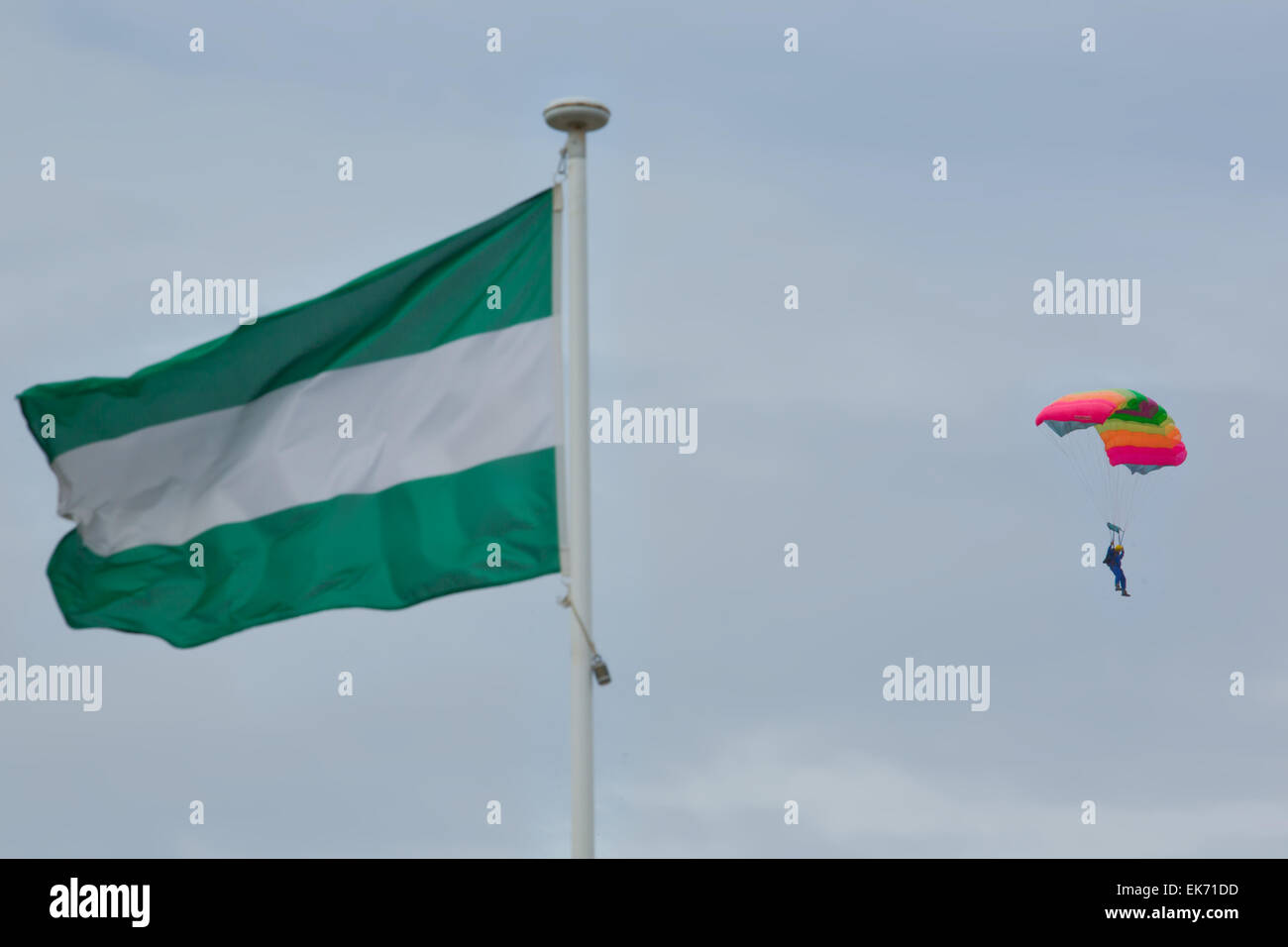 A skydiver performing skydiving with andalusian flag Stock Photo - Alamy