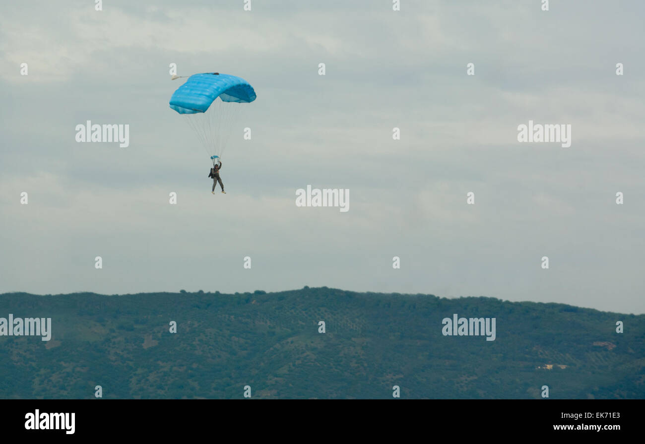 A skydiver performing skydiving with blue sky in the background Stock ...