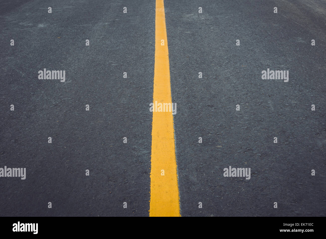 Asphalt road texture with yellow stripe Stock Photo - Alamy