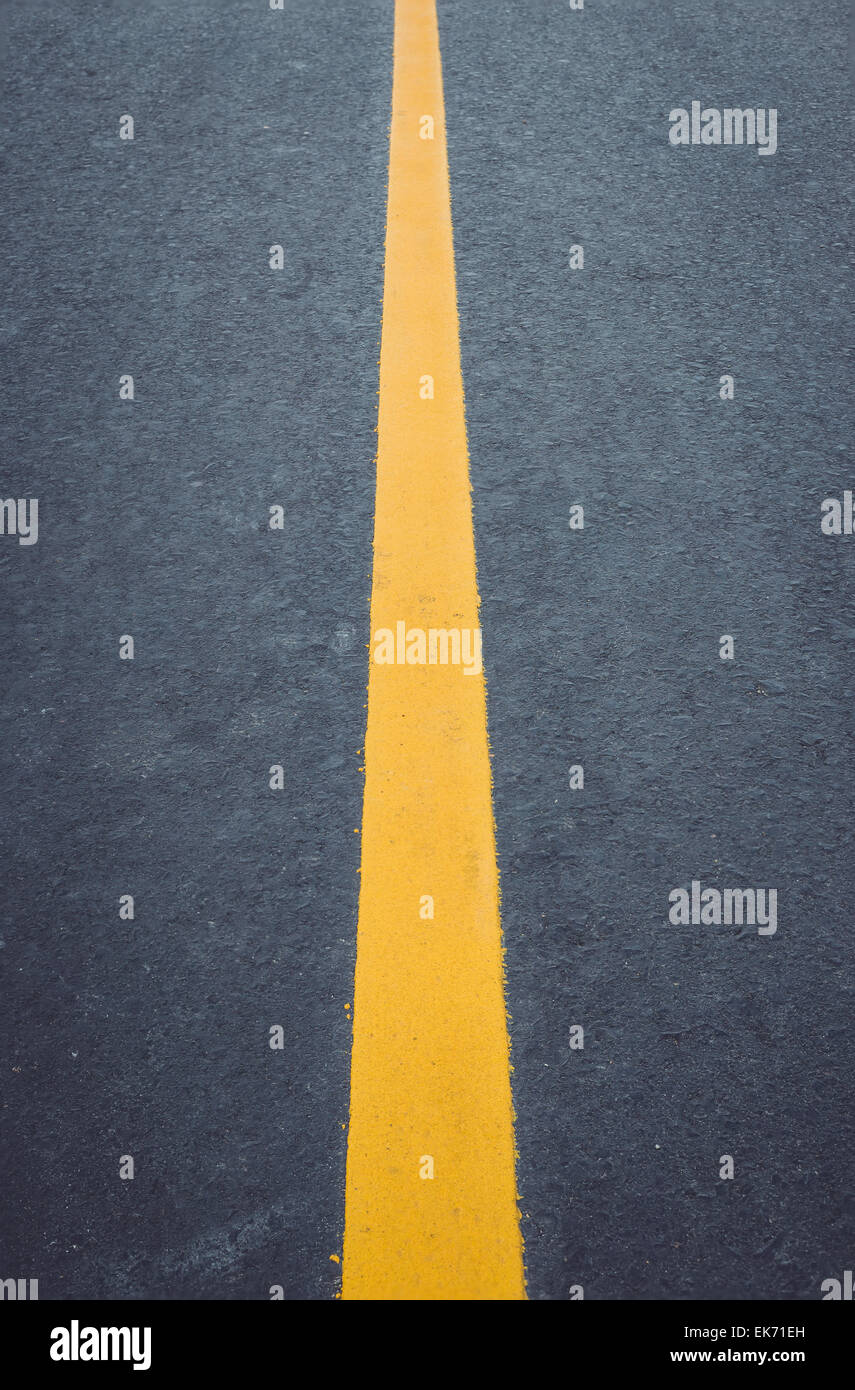 Asphalt road texture with yellow stripe Stock Photo - Alamy