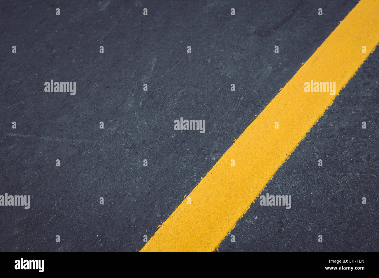 Asphalt road texture with yellow stripe Stock Photo - Alamy