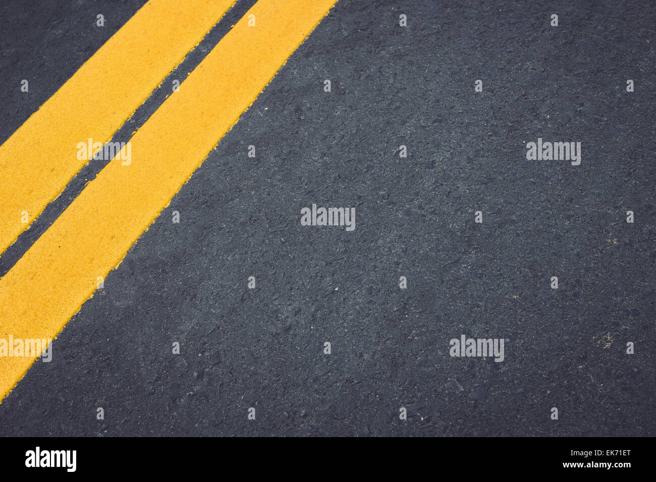 Asphalt road texture with yellow stripe Stock Photo - Alamy