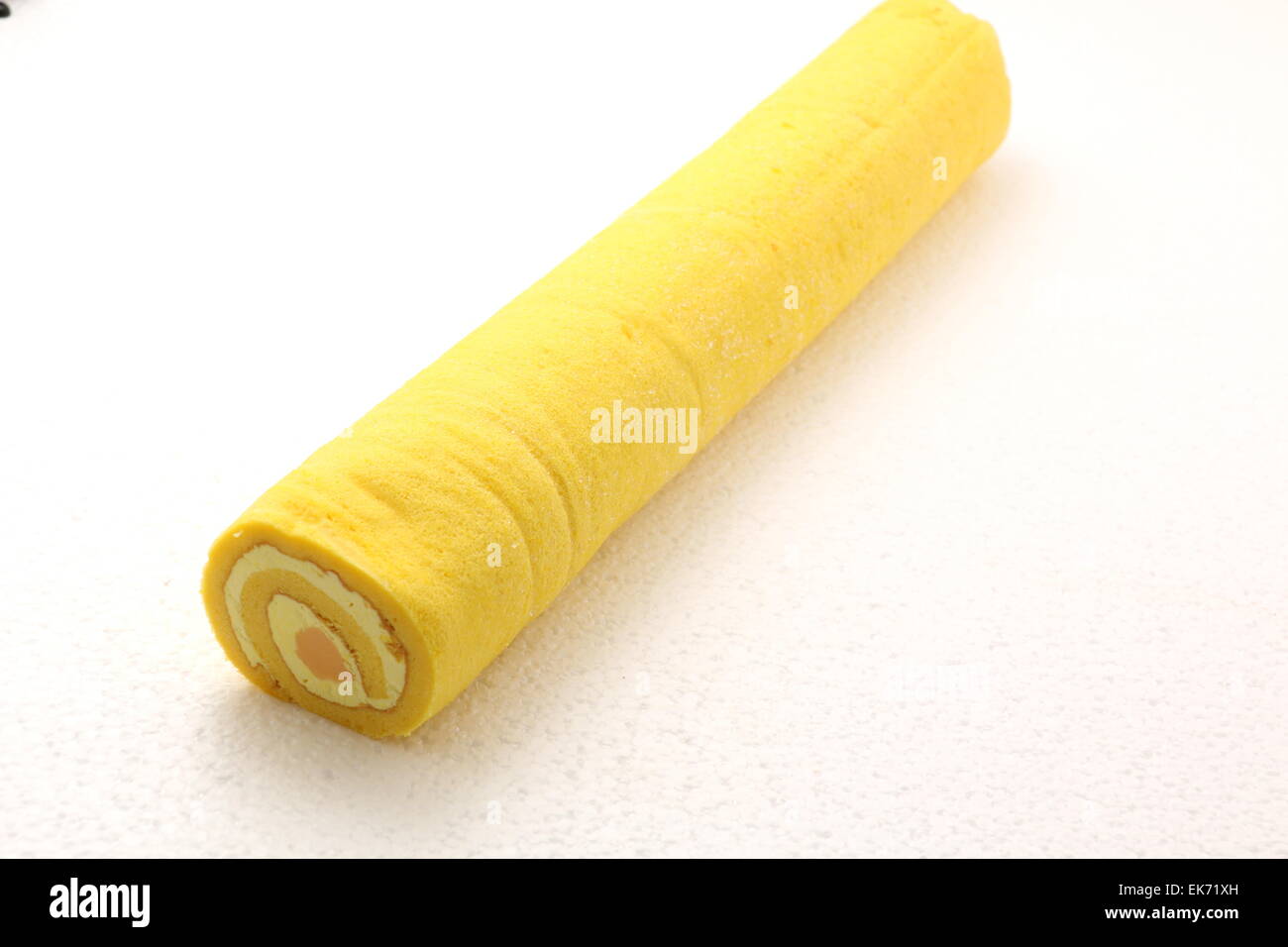 swiss cream Roll cake on white background Stock Photo - Alamy