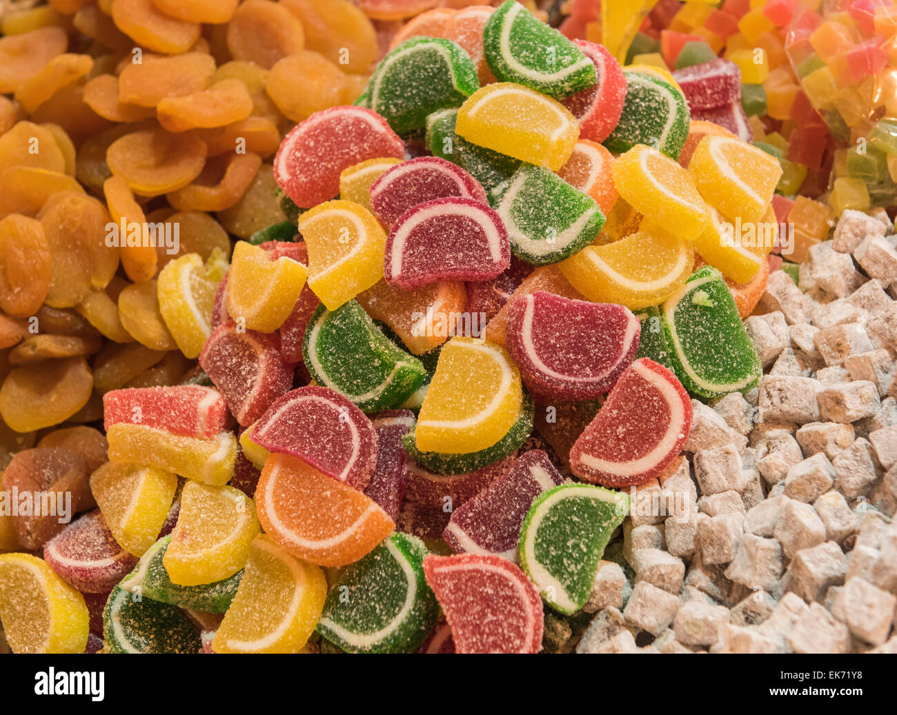 Closeup detail of colorful sugary boiled fruit sweets on display at a ...