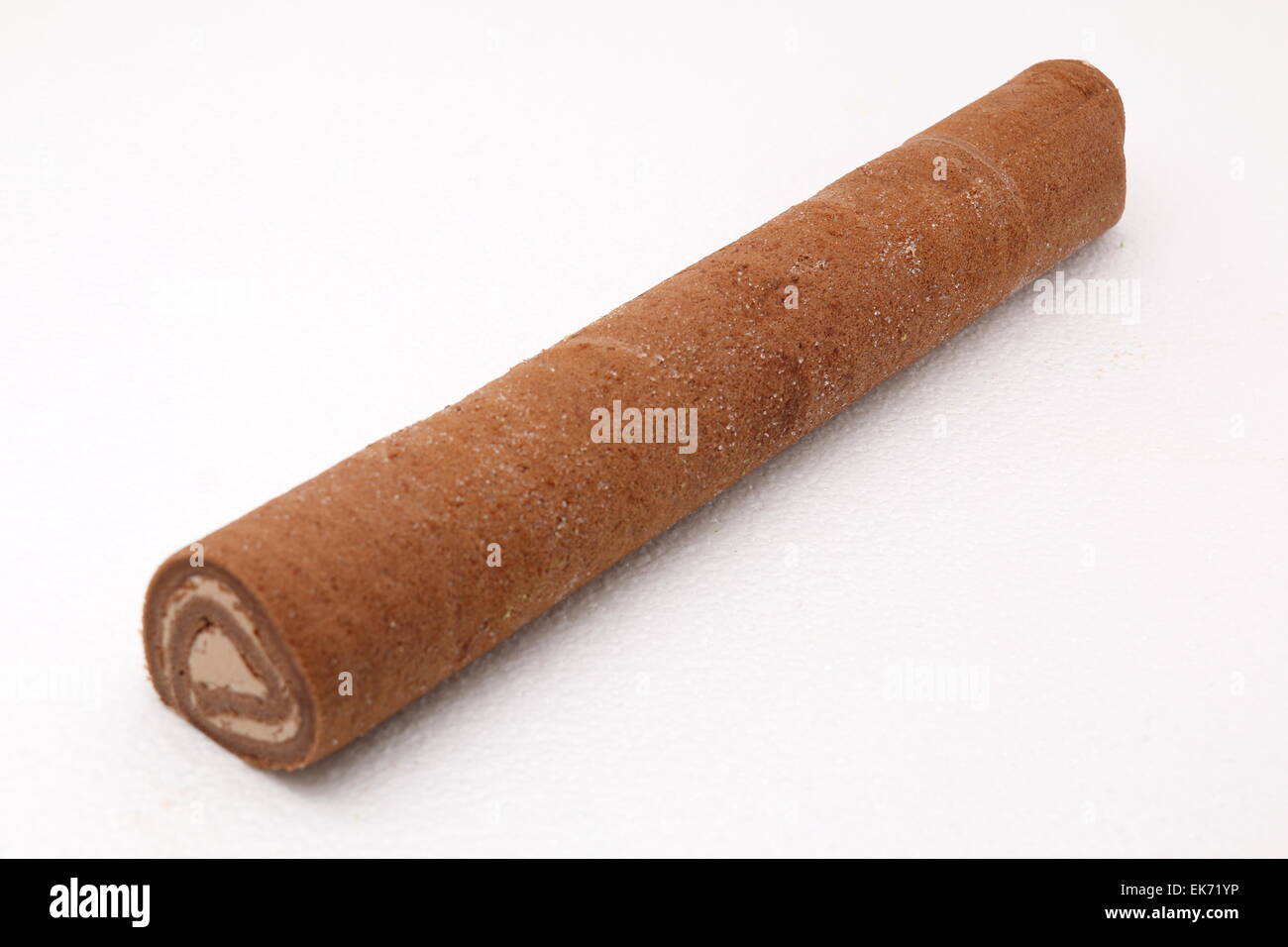 swiss cream Roll cake on white background Stock Photo - Alamy