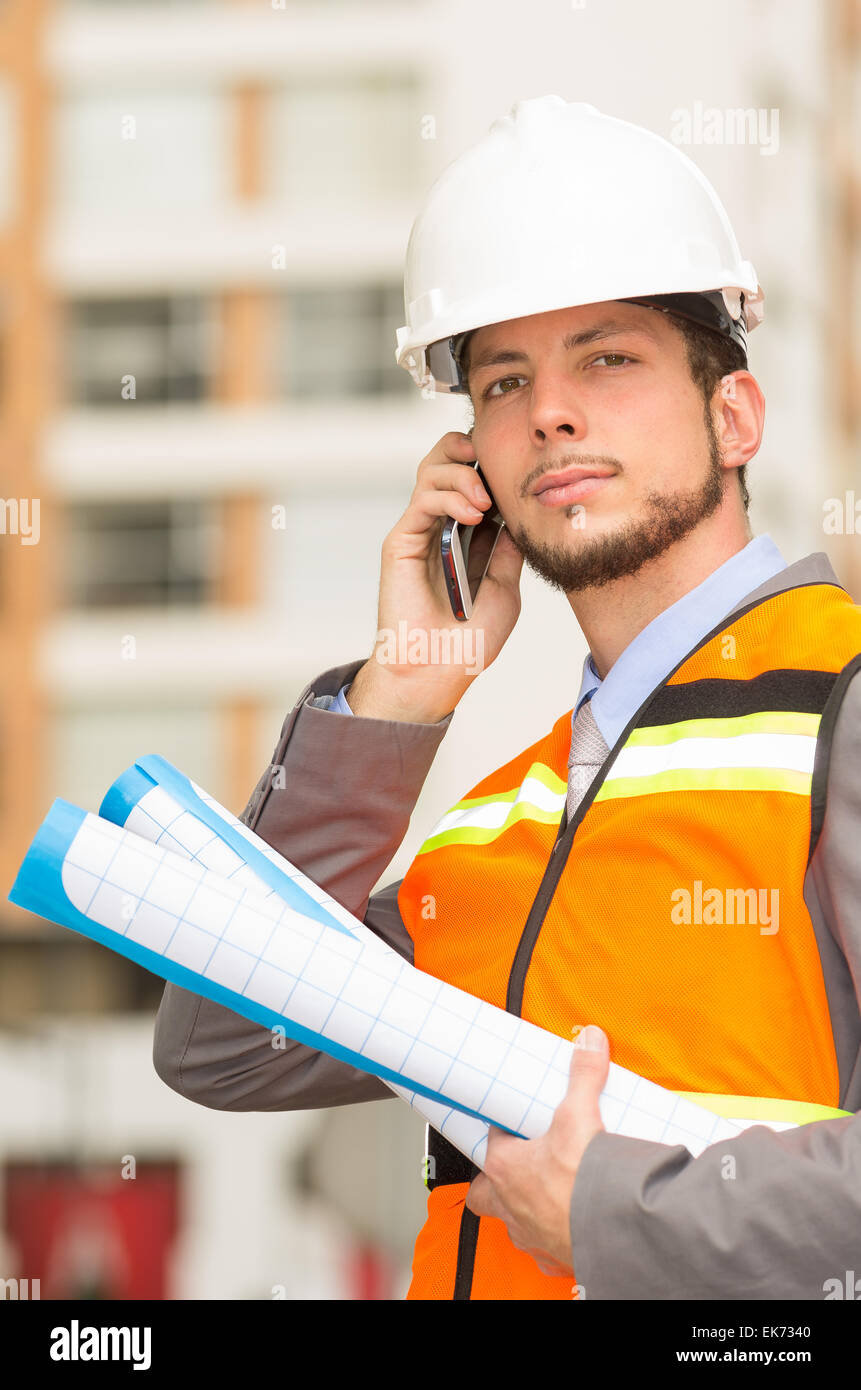 young handsome architect supervising a construction Stock Photo - Alamy