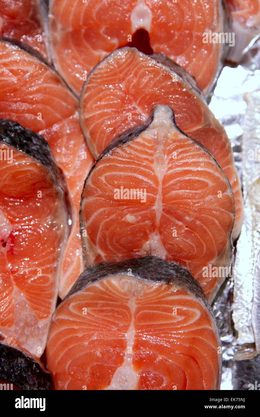 Salmon fish vivid slices in a row Stock Photo - Alamy