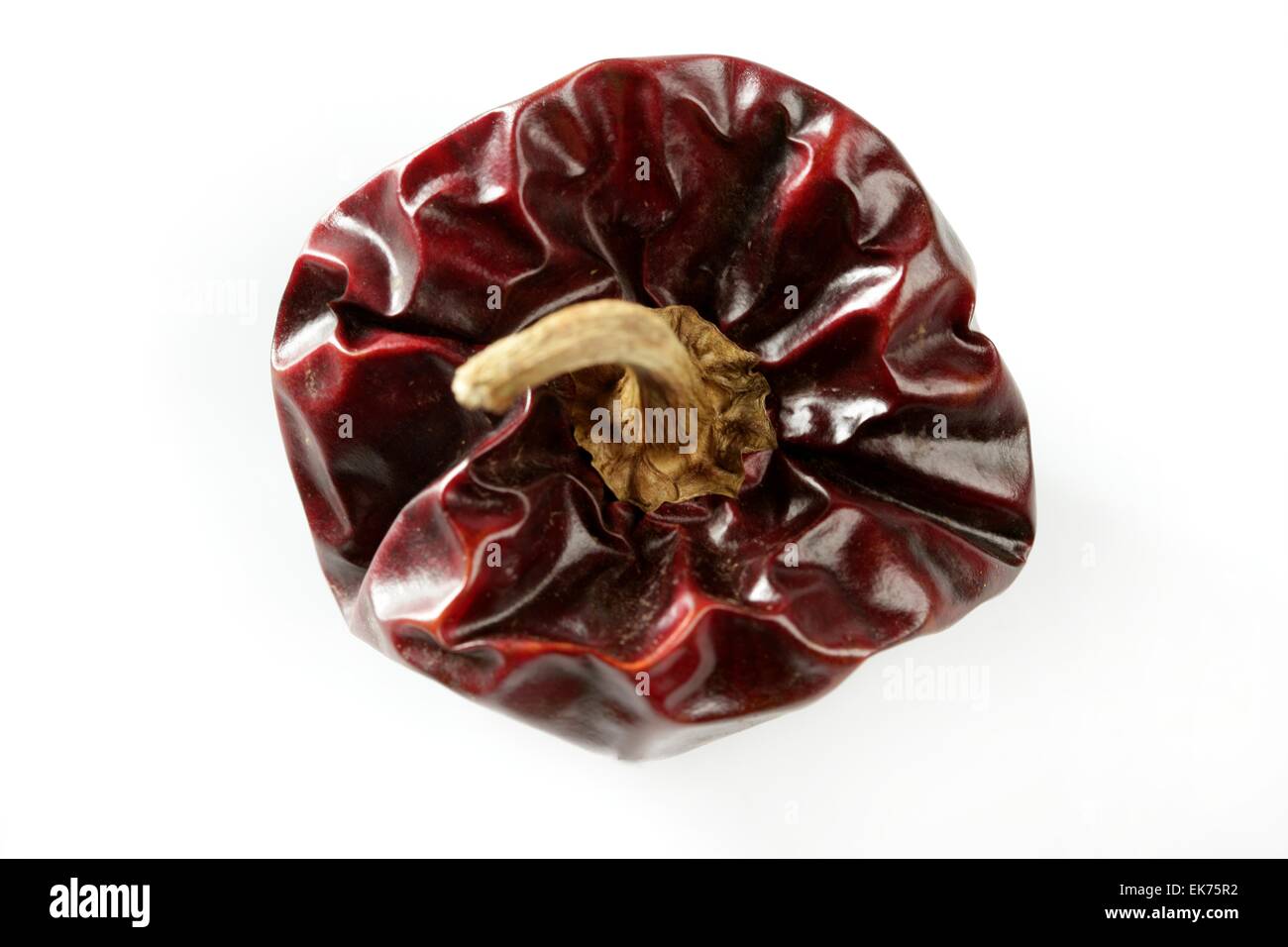 One round Mediterranean dried dark red peppers Stock Photo - Alamy
