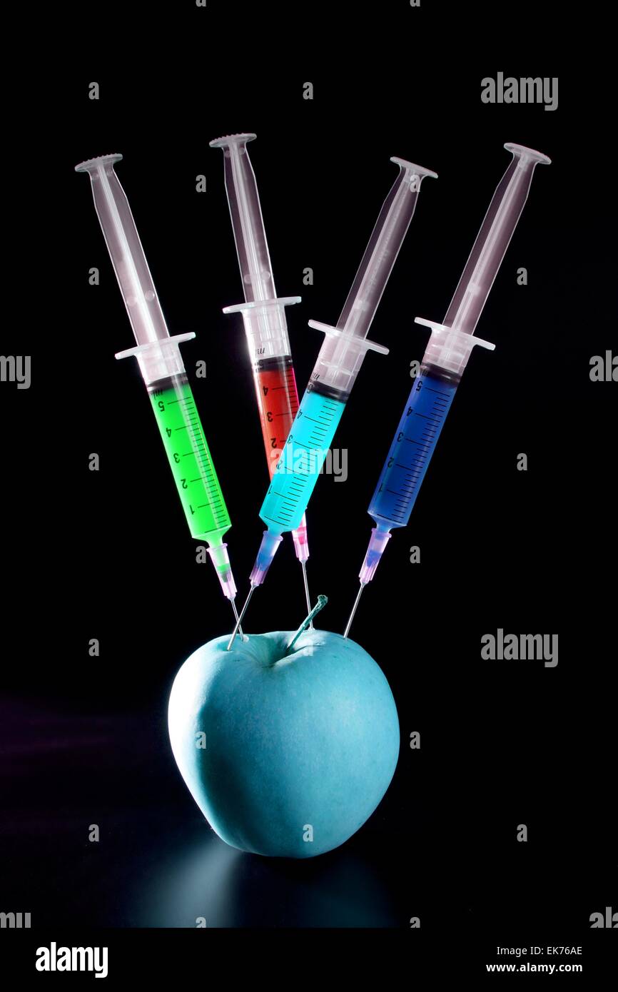 apple manipulation with syringes Stock Photo - Alamy
