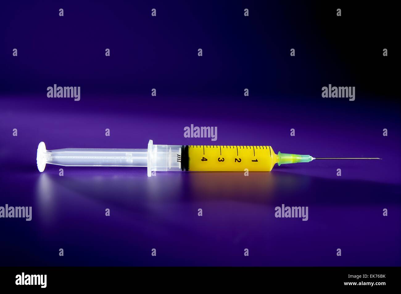 yellow syringe with needle, health, genetics Stock Photo - Alamy