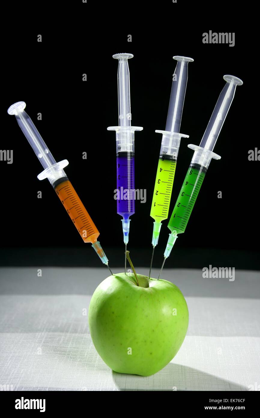 apple manipulation with syringes Stock Photo - Alamy