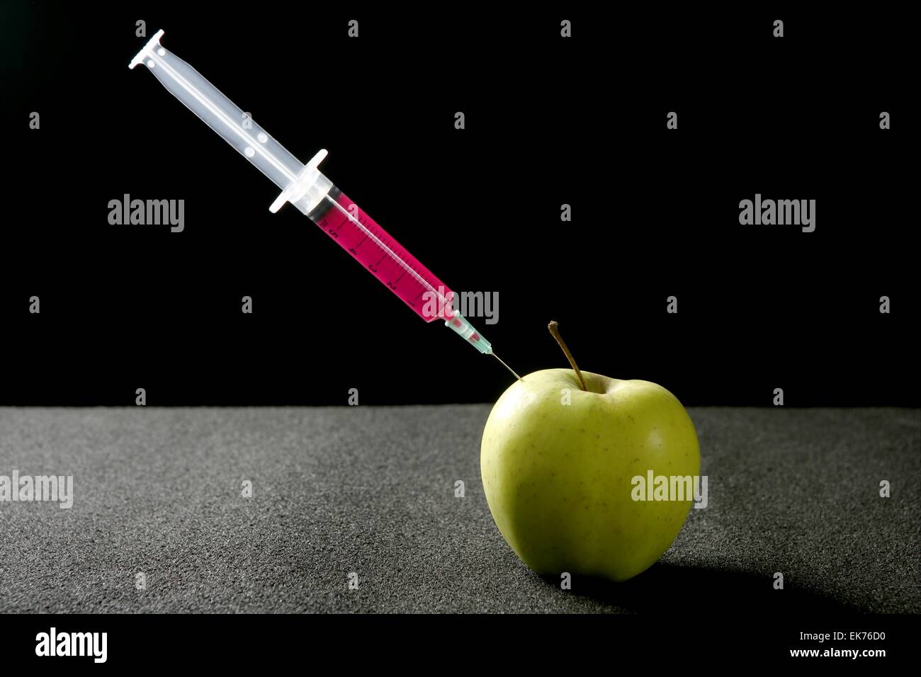 apple manipulation with syringe Stock Photo - Alamy