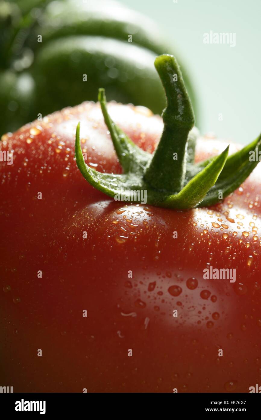 Two color tomatoes, green and red variety Stock Photo - Alamy