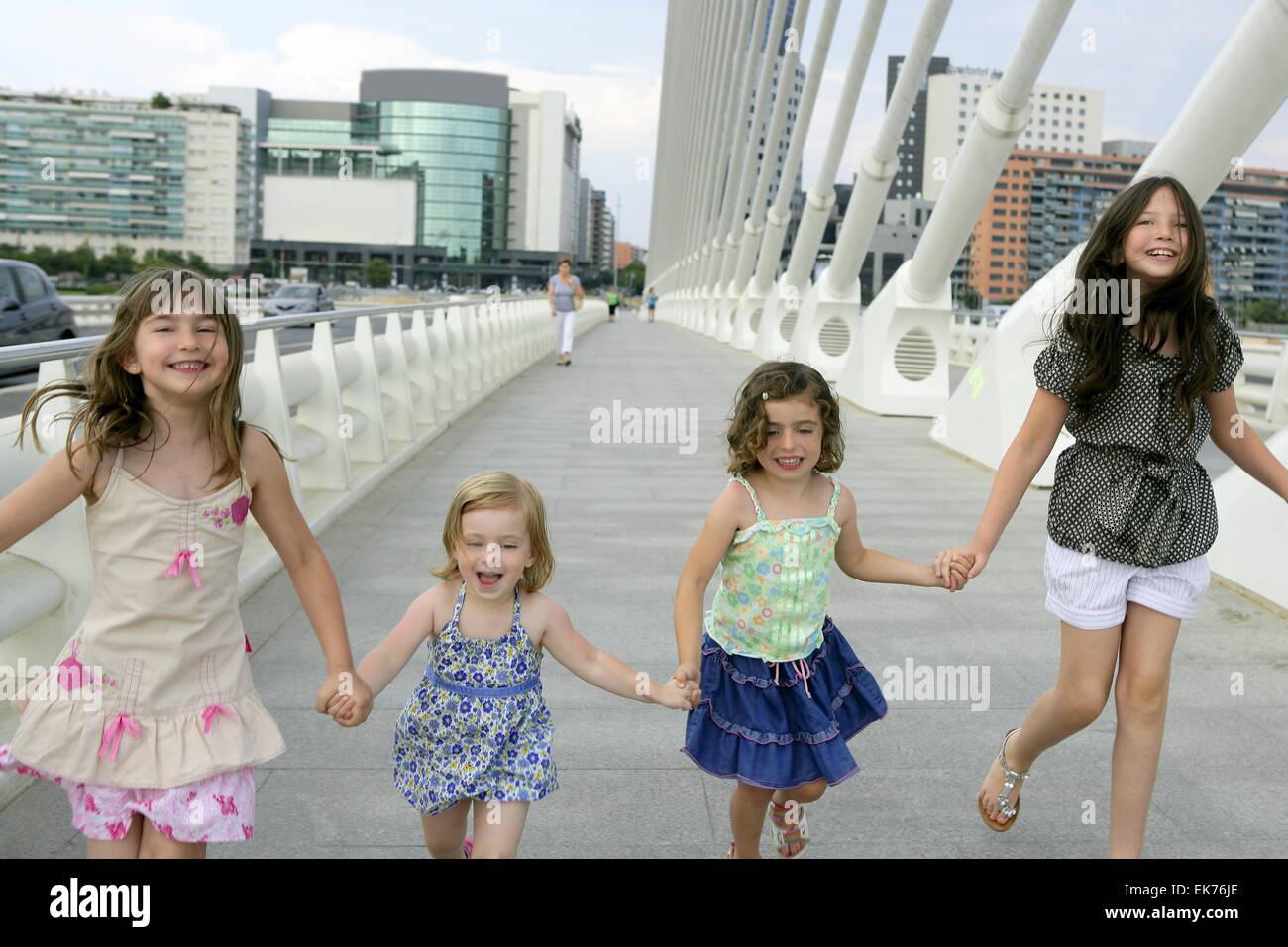Four school girls walking together hi-res stock photography and images ...
