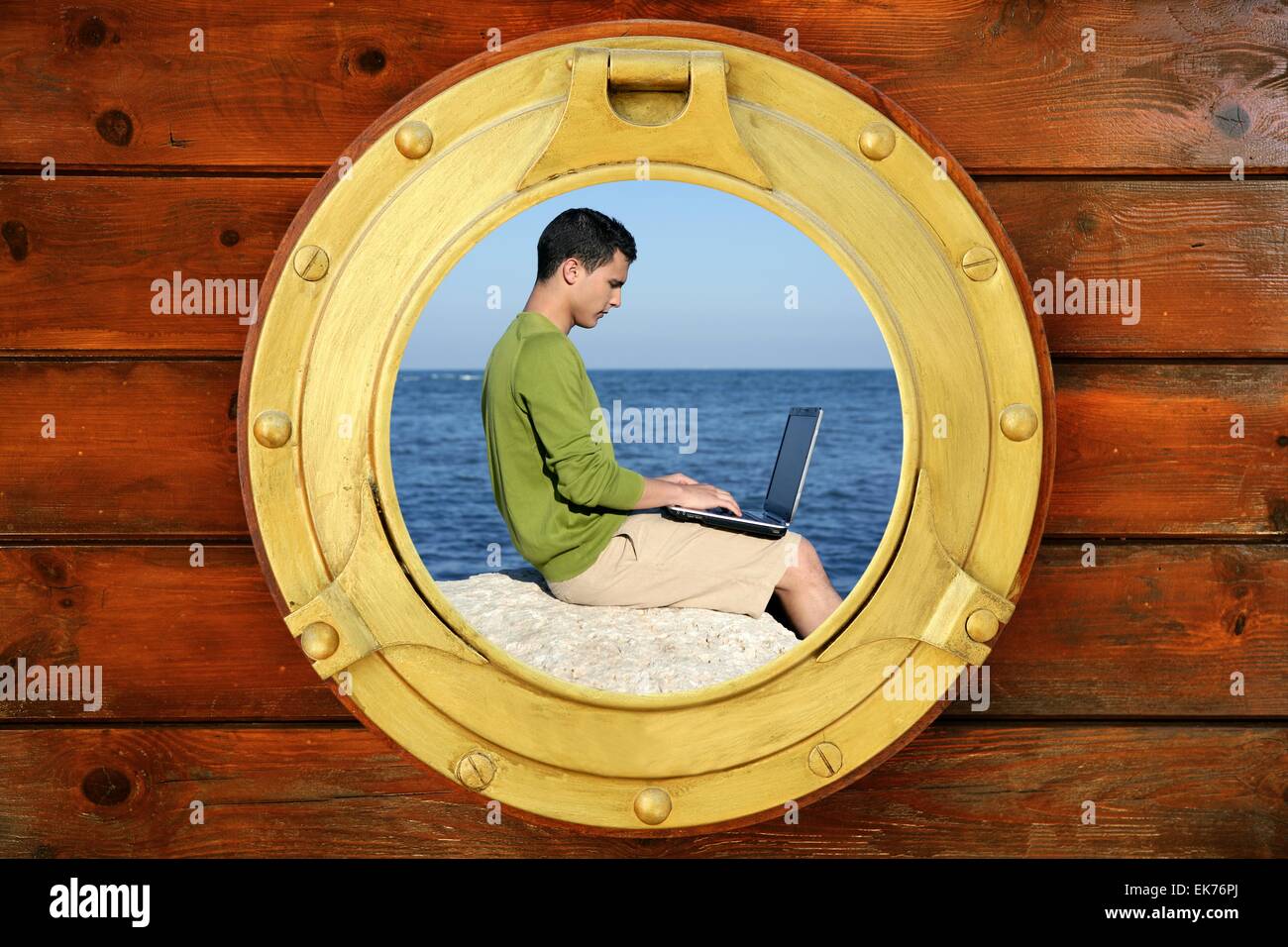 Businessman with computer, boat window view Stock Photo - Alamy