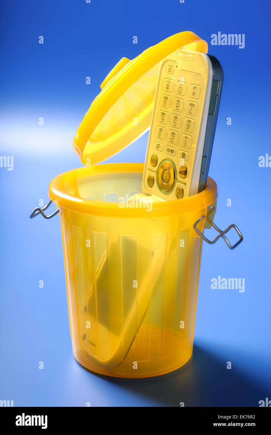 Mobil cell phone on the trash Stock Photo - Alamy