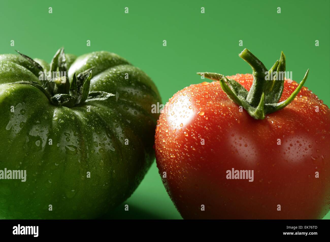 Two color tomatoes, green and red variety Stock Photo - Alamy