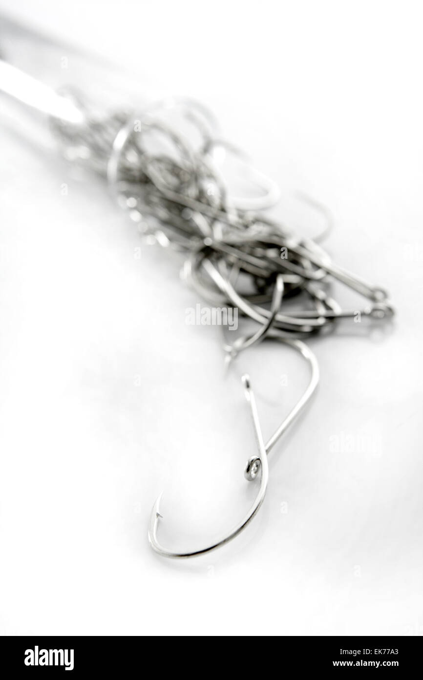 fishing hooks over white background Stock Photo - Alamy