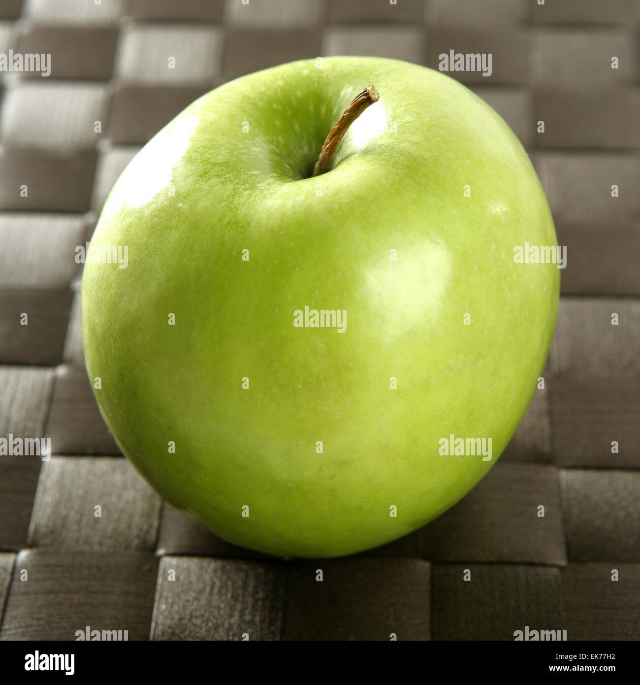 apple on a brown tablecloth Stock Photo - Alamy