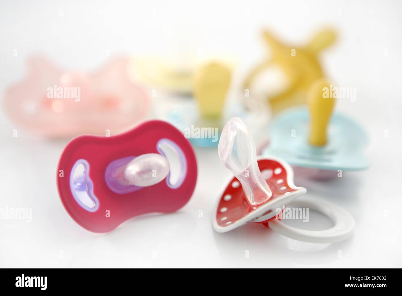 baby pacifier set over white background Stock Photo - Alamy