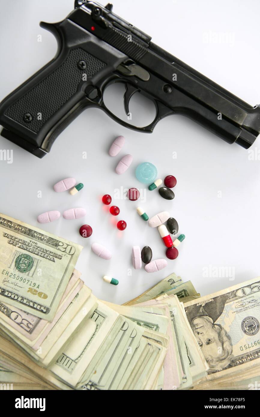 Dollar notes and gun, black pistol Stock Photo - Alamy
