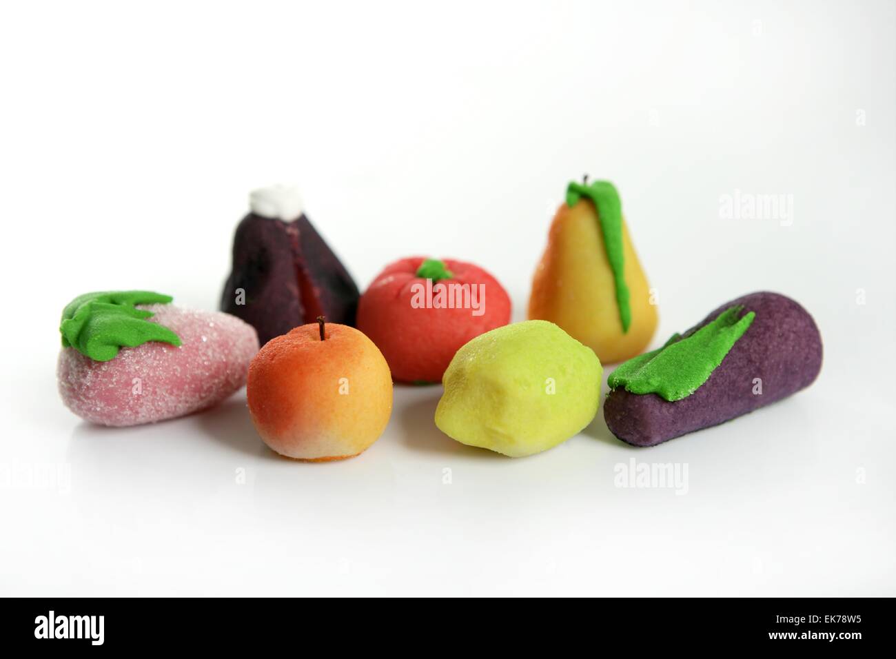 Variety of fruits on colorful marzipan Stock Photo - Alamy