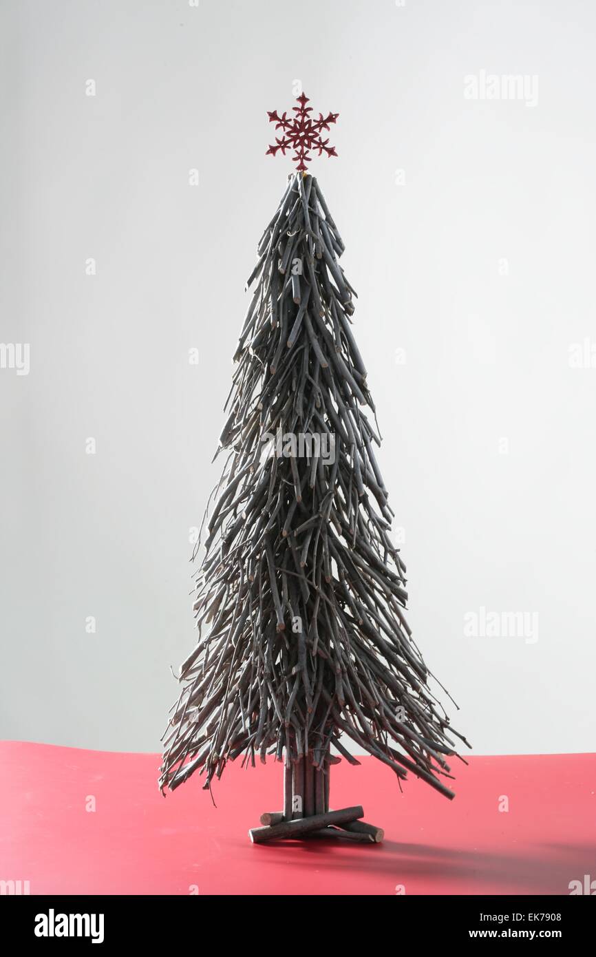 Original wood sticks christmas tree, simple at studio Stock Photo - Alamy