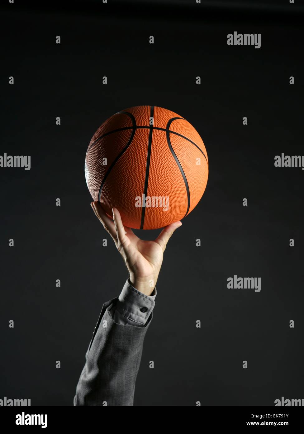 Businessman with basketball ball, teamwork, leadership Stock Photo - Alamy