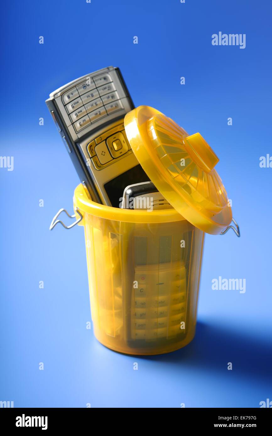 Mobil cell phone on the trash Stock Photo - Alamy