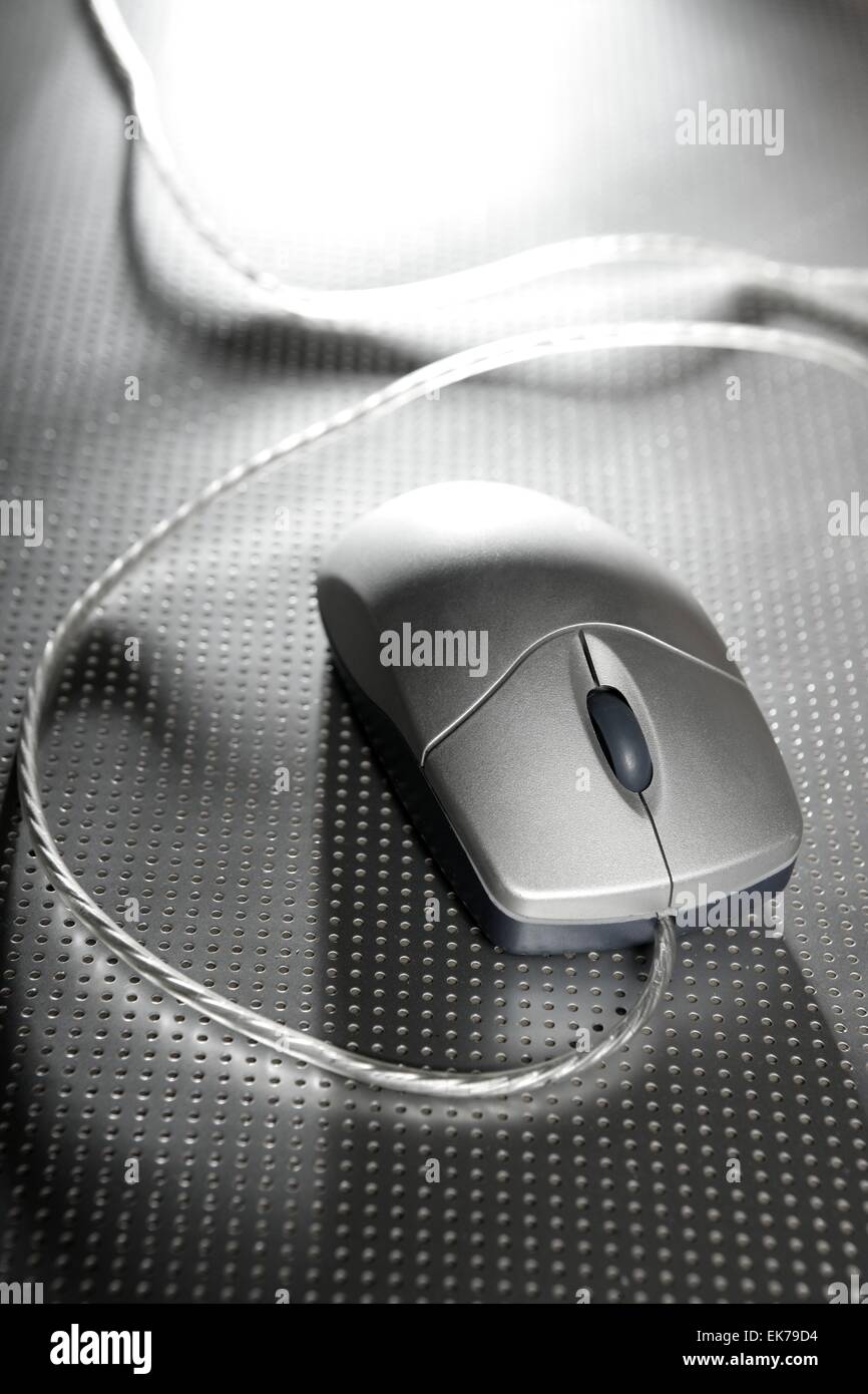 Silver computer wired mouse over metal steel background Stock Photo - Alamy