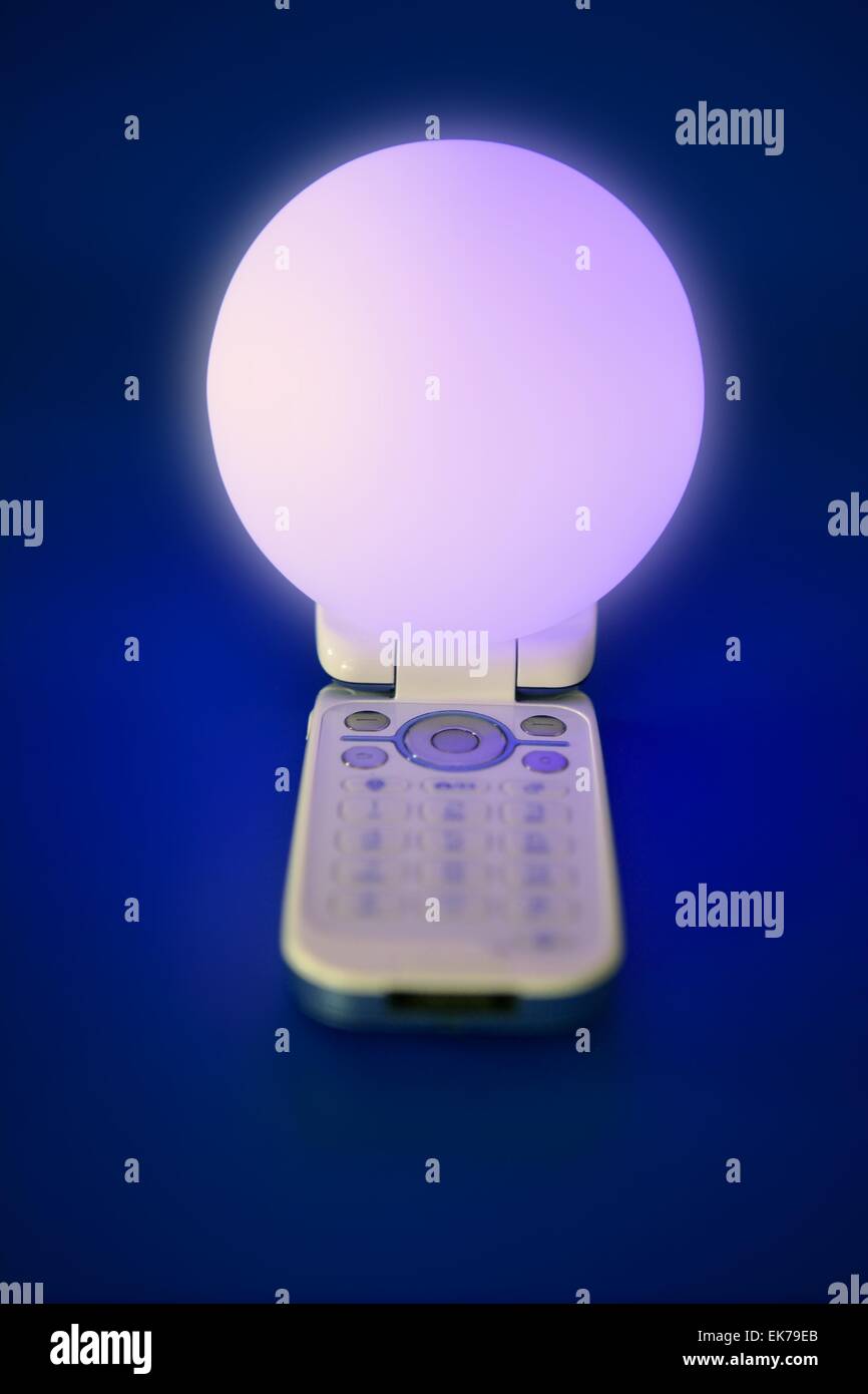 glowing light sphere on mobile cellphone Stock Photo - Alamy