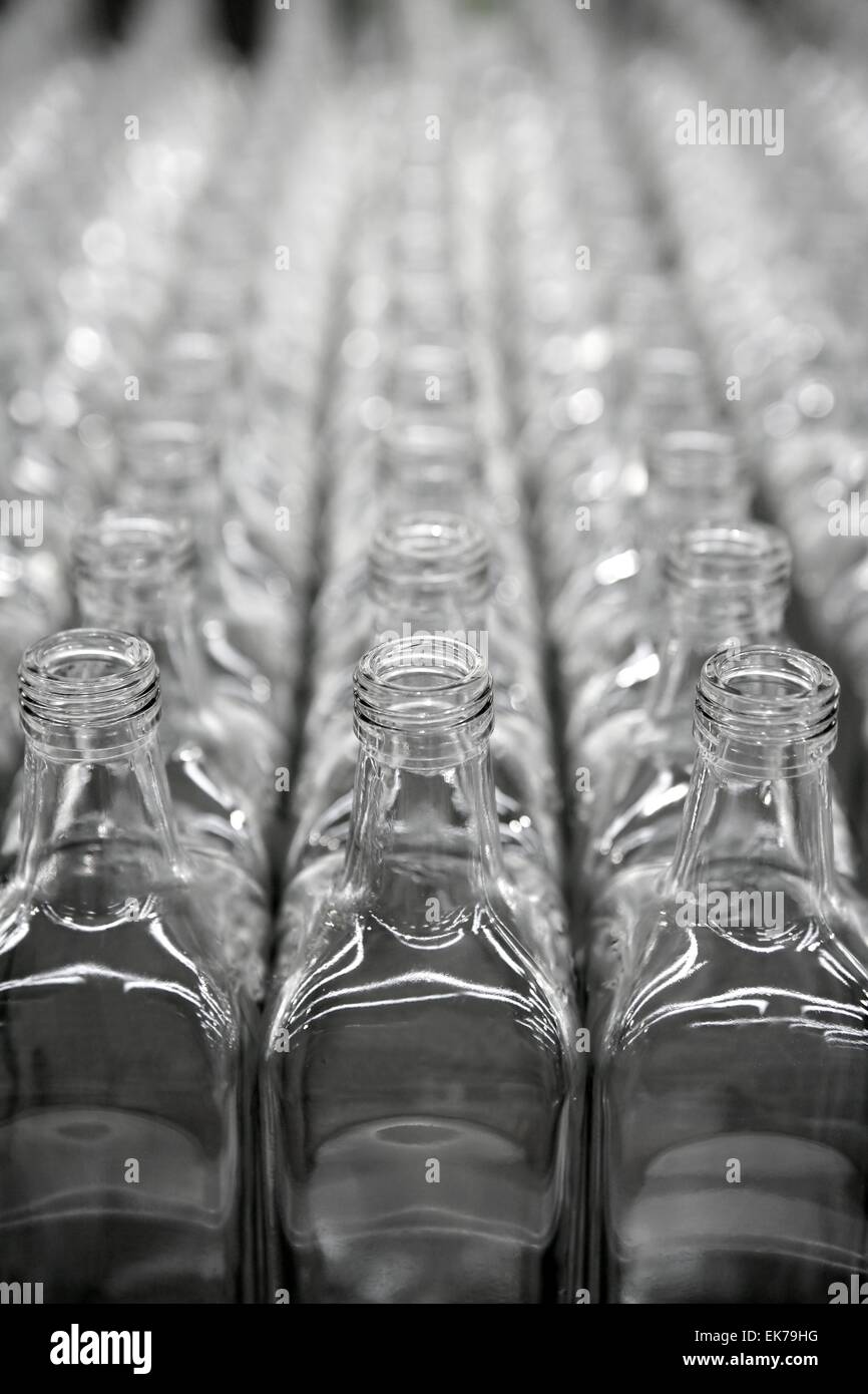 Glass square transparent bottle rows Stock Photo - Alamy