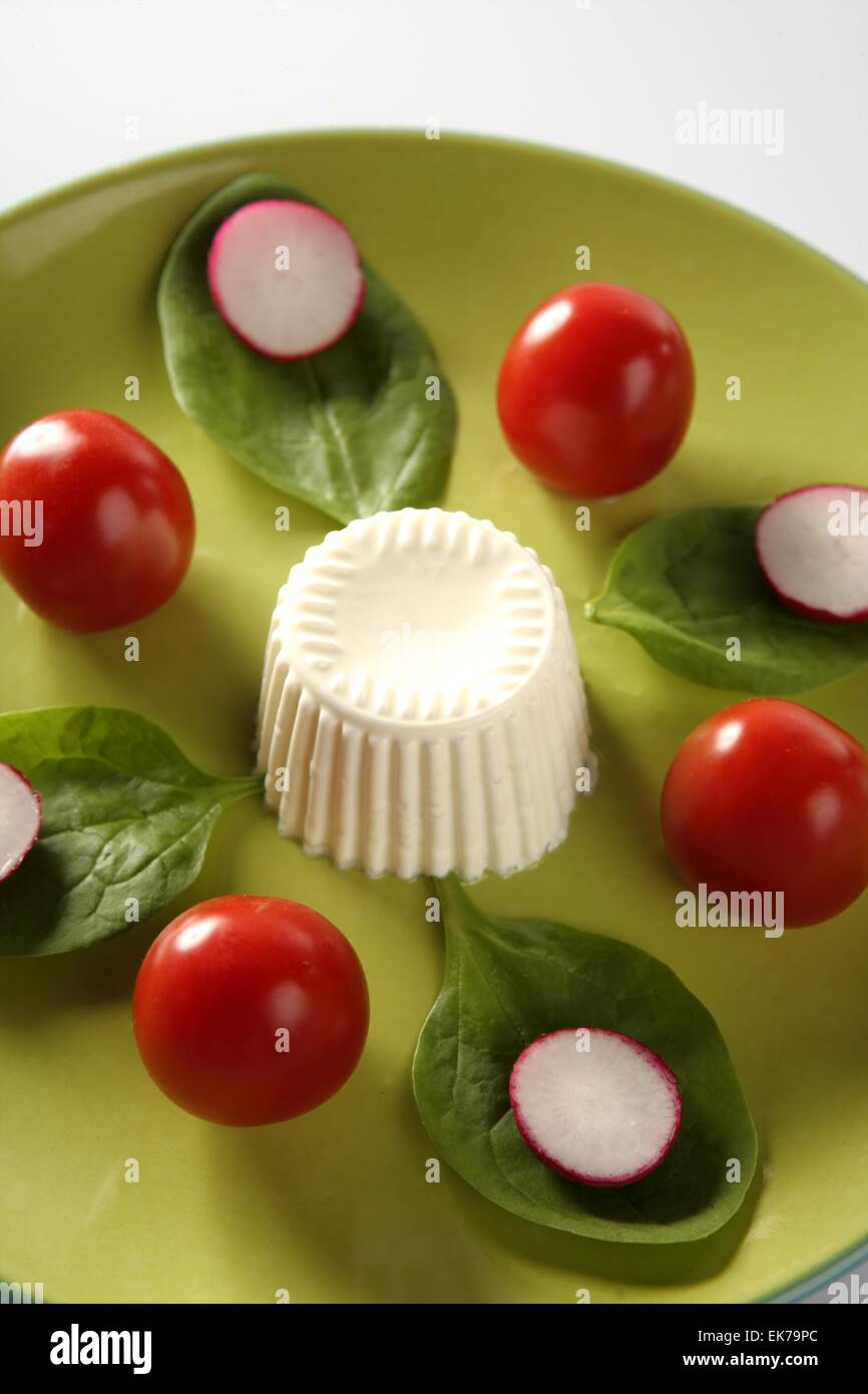Tomato, radish and fresh cheese salad Stock Photo - Alamy