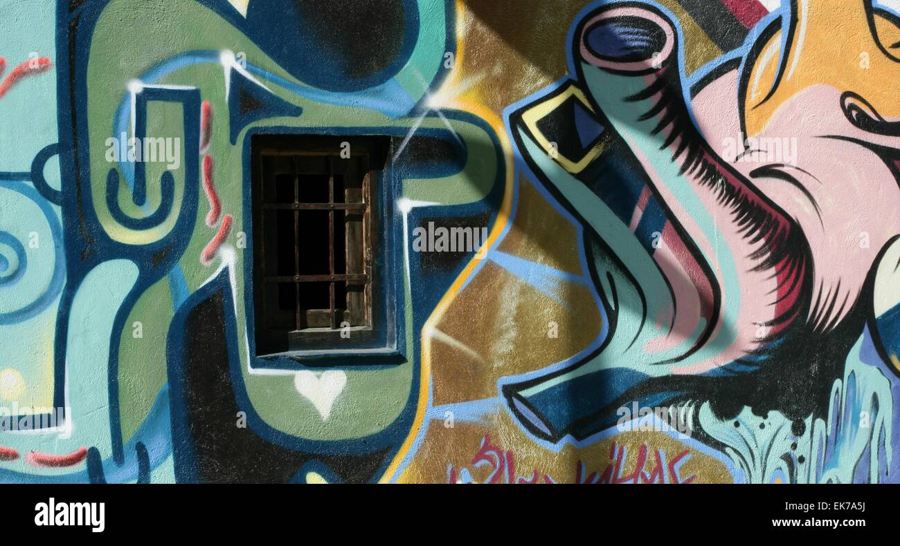 Decorated house and window with graffiti on wall Stock Photo - Alamy