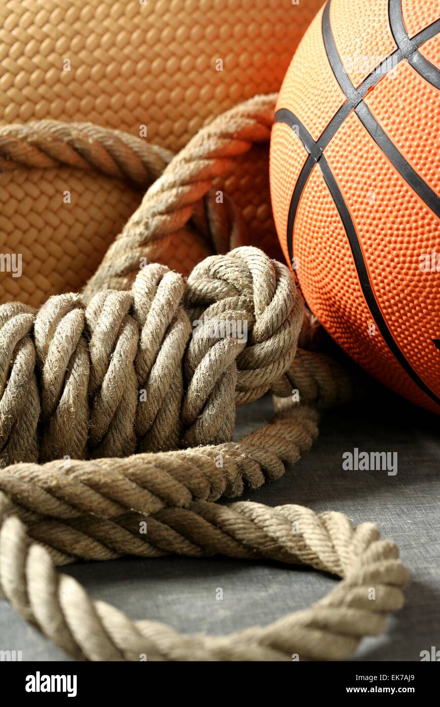 Gym corner, basketball ball and rope Stock Photo - Alamy