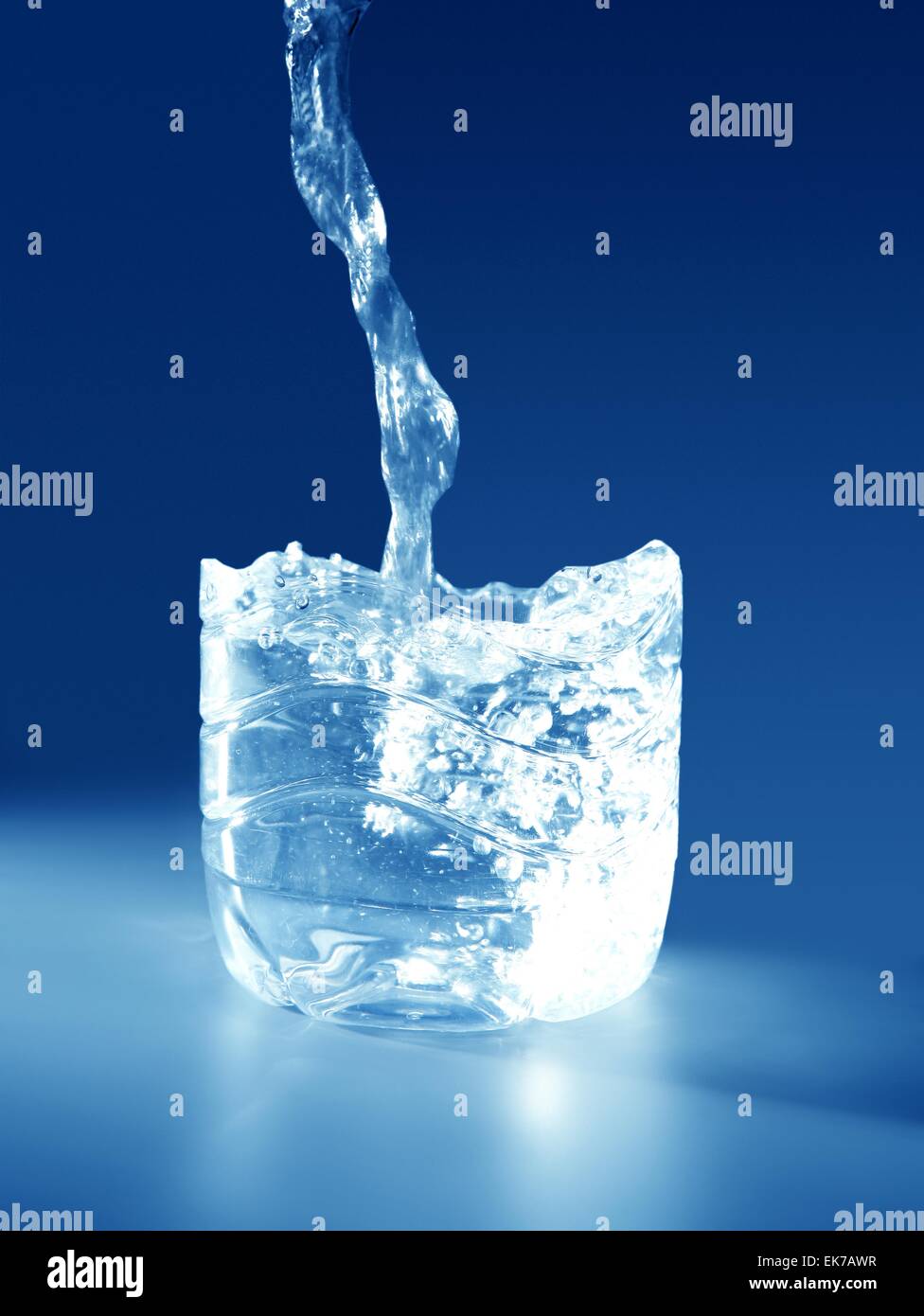 Natural mineral blue water falling down Stock Photo - Alamy