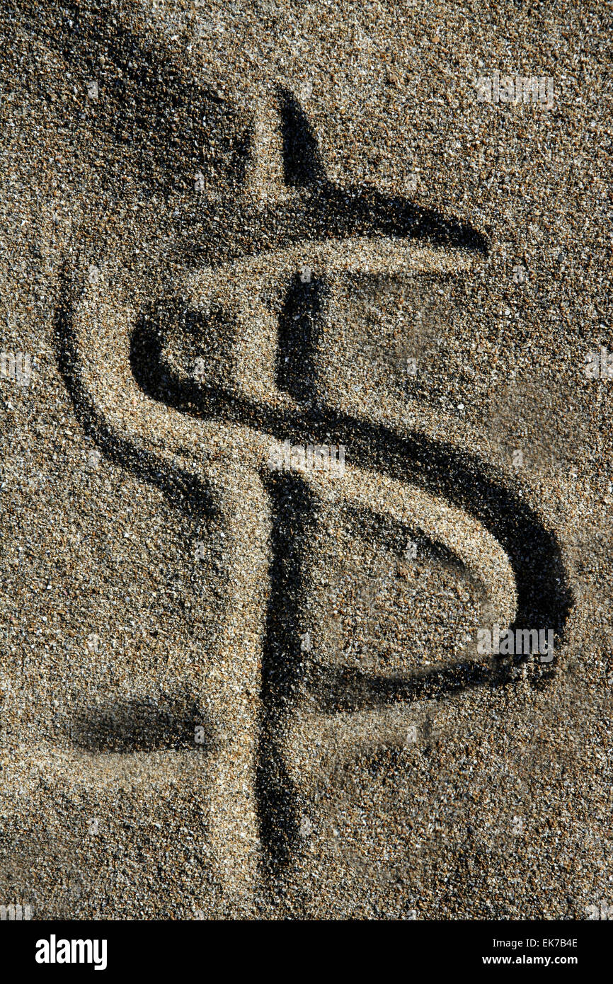 American currency dollar sign on the beach sand Stock Photo - Alamy