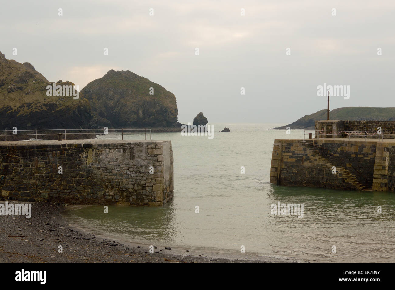 View from Mullion harbour of Mullion Cove and Mullion Island, Cornwall ...