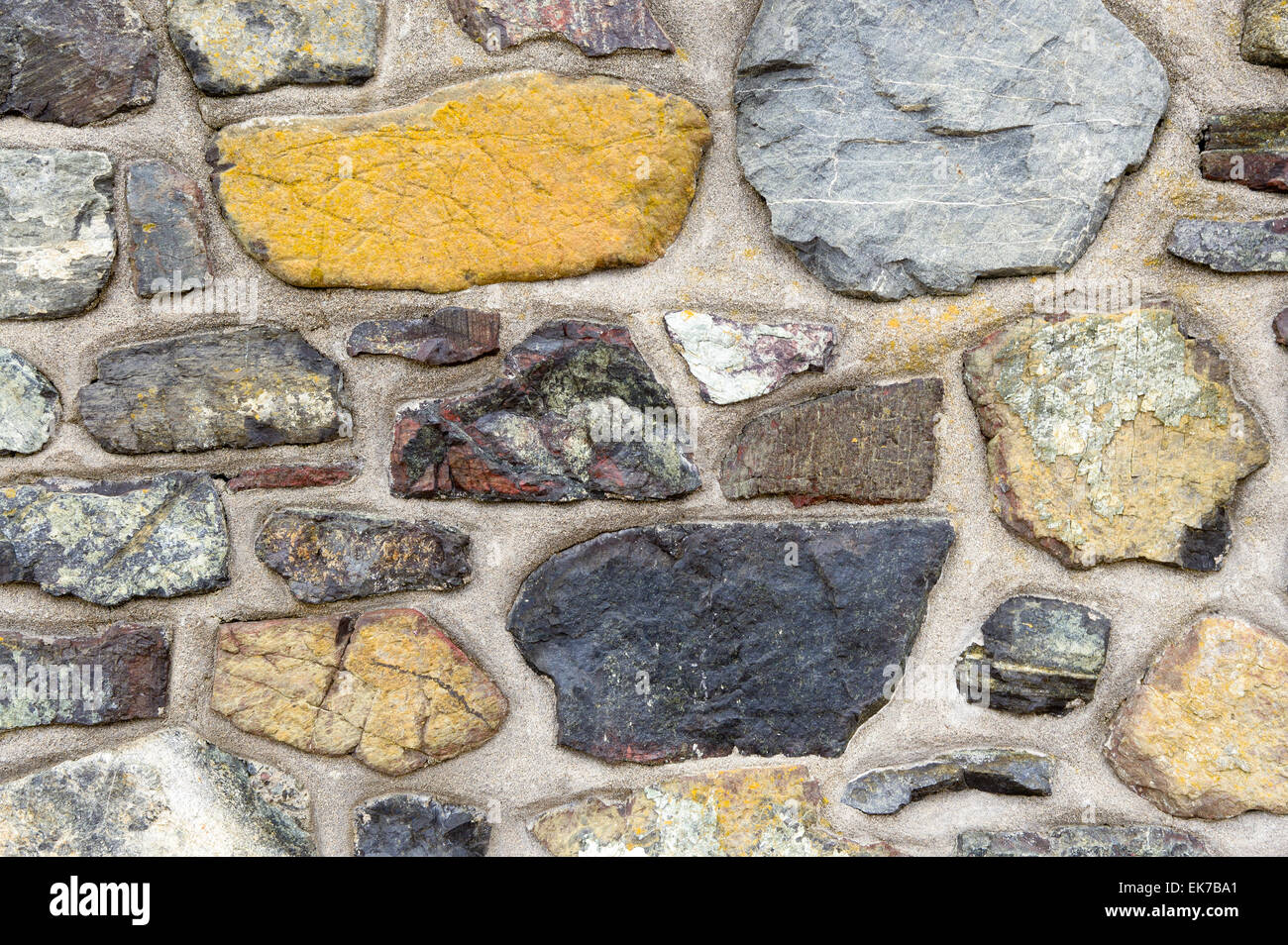 Brightly coloured stone wall in Mullion, Cornwall, England Stock Photo ...