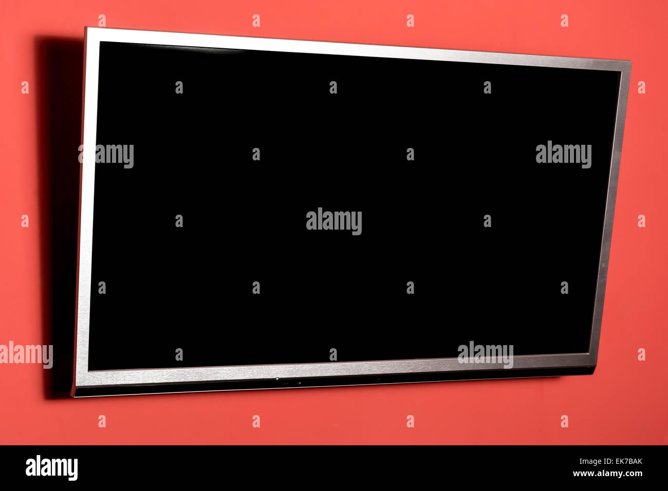 Led tv hanging on the wall Stock Photo - Alamy